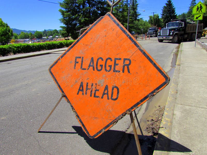 Flagger Ahead Sign stock photo. Image of orange, works - 29820034