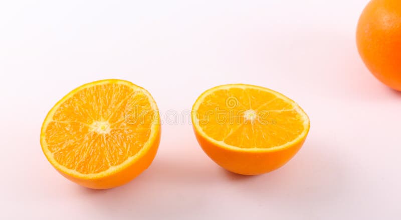 Two Halves Of Orange On Wooden Plate Stock Photo - Image of food, plate ...