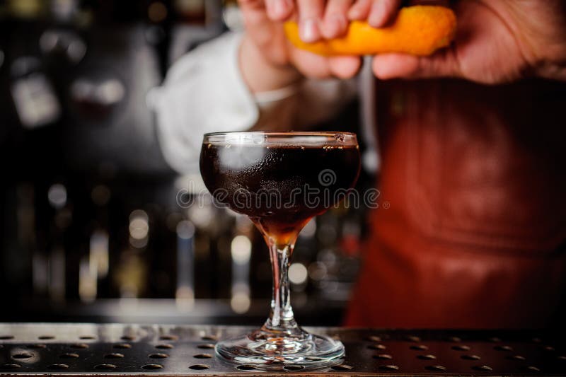 Orange Garnish Spray Over a Drink Stock Photo - Image of glass, cold ...