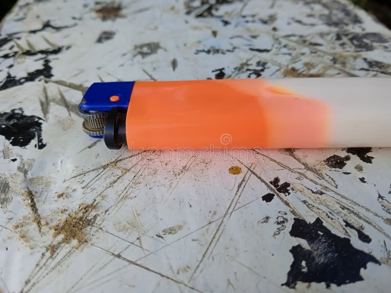Orange Gas Lighter on Board. Stock Photo - Image of food, blue: 275307412