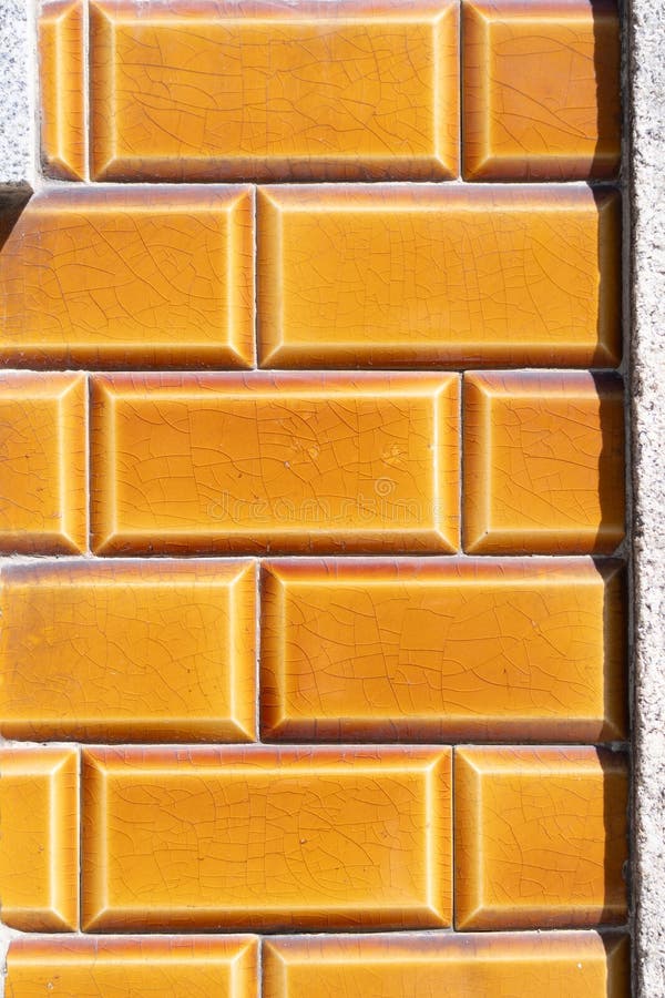 Orange Glazed Ceramic Tiles Forming a Geometric Pattern on a Wall Stock ...