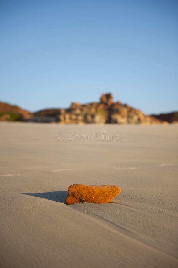 Orange Glowing Rock on Lonely Beach Stock Photo - Image of holiday ...