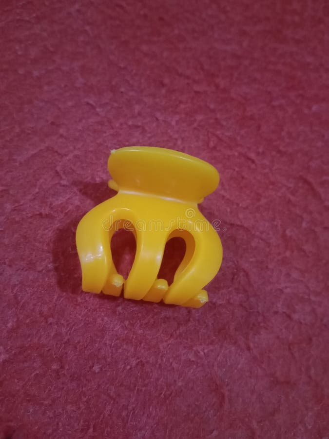 Orange Hair Clip. Red Background Stock Image - Image of lighting, hand ...