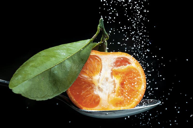 Orange half on spoon stock image. Image of clementine - 42034547