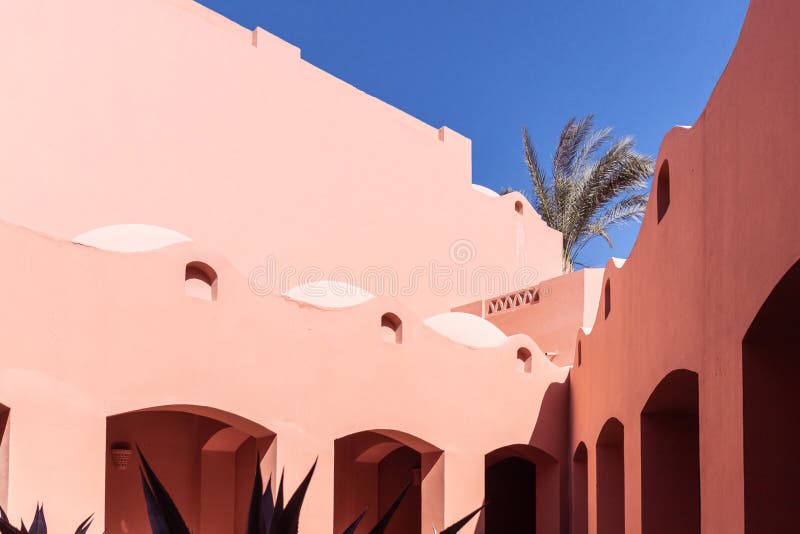 Orange Hotel Building with Many Arches in Bright Sunlight with ...