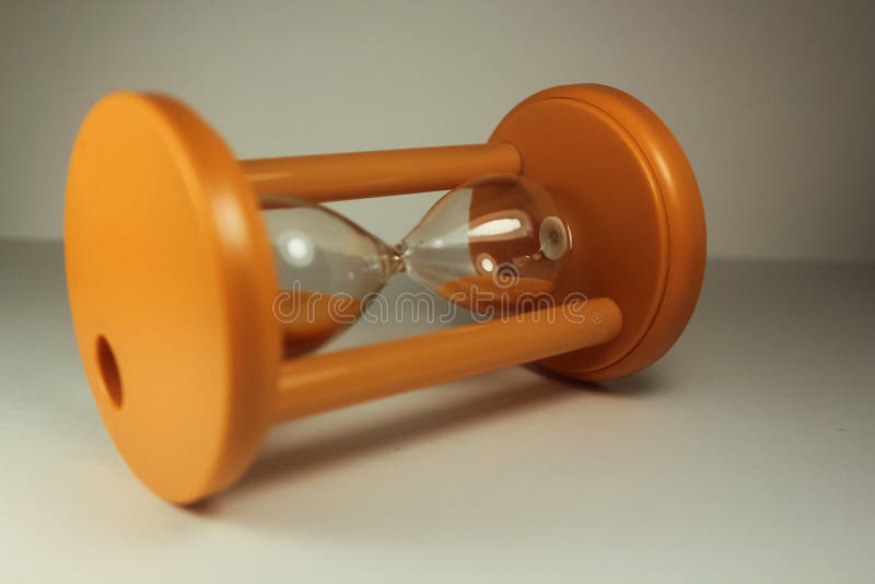 An Orange Hourglass Lies in the Shade Stock Photo - Image of bright ...