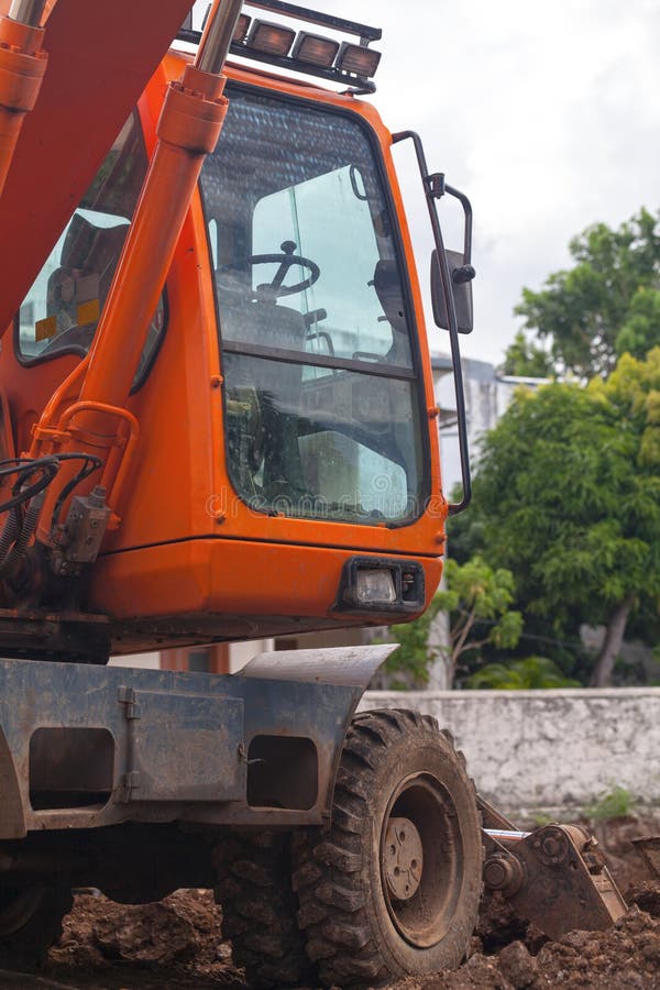Orange Hydraulic Excavator at a Construction Site Stock Photo - Image ...