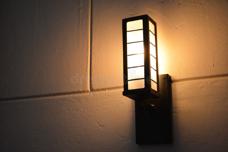 Orange Incandescent Light Bulb Mount on Wall Stock Image - Image of ...