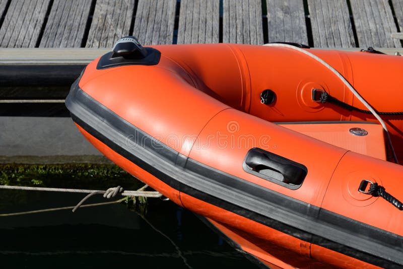 Orange Inflatable Boat Moored Near the Pier Stock Image - Image of ...