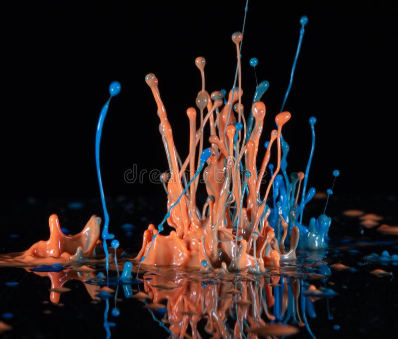 Orange Ink Splash on a Black Background Stock Image - Image of ...
