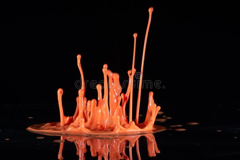 Orange Ink Splash on a Black Background Stock Image - Image of colour ...