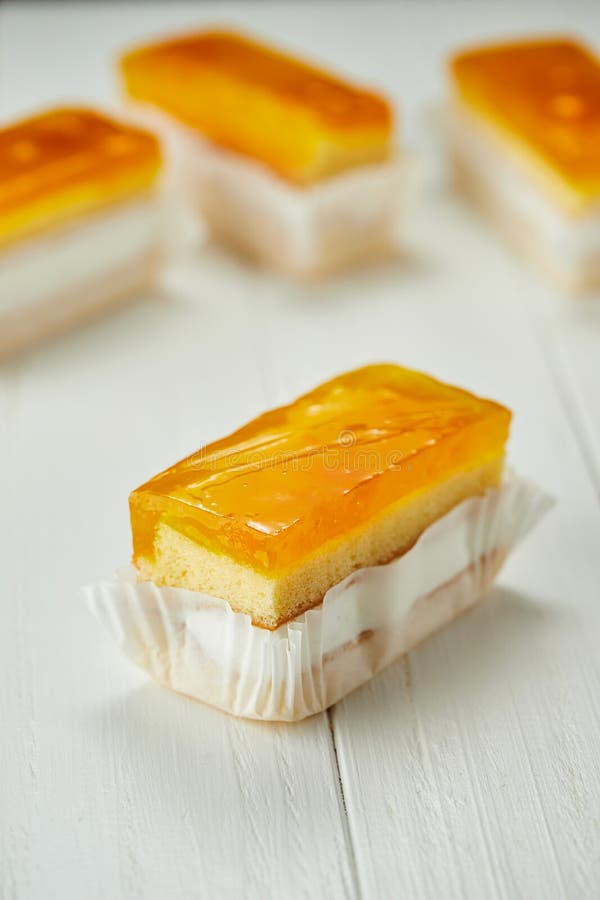 Orange Jelly Sponge Cakes on Wooden Background Stock Photo - Image of ...