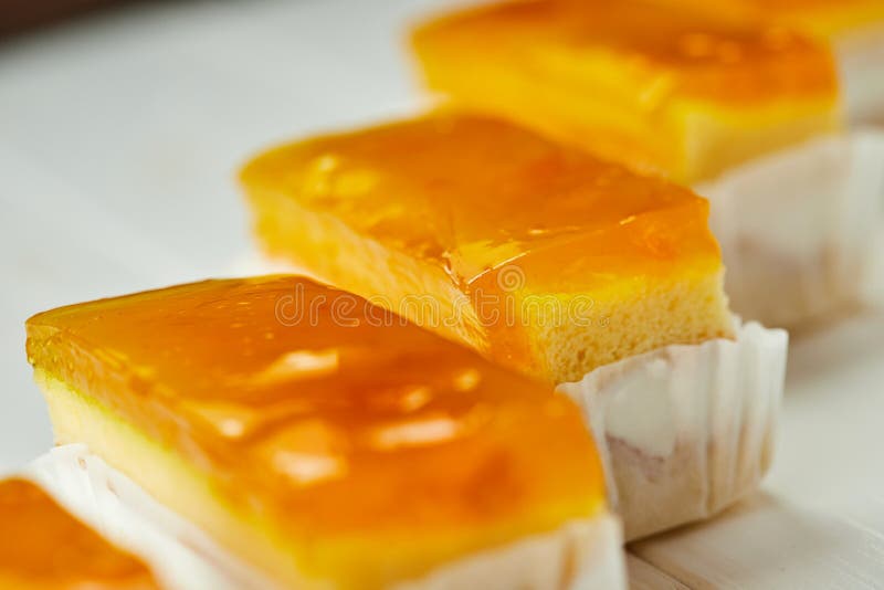 Orange Jelly Sponge Cakes on Wooden Background Stock Photo - Image of ...