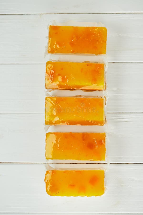 Orange Jelly Sponge Cakes on Wooden Background Stock Image - Image of ...