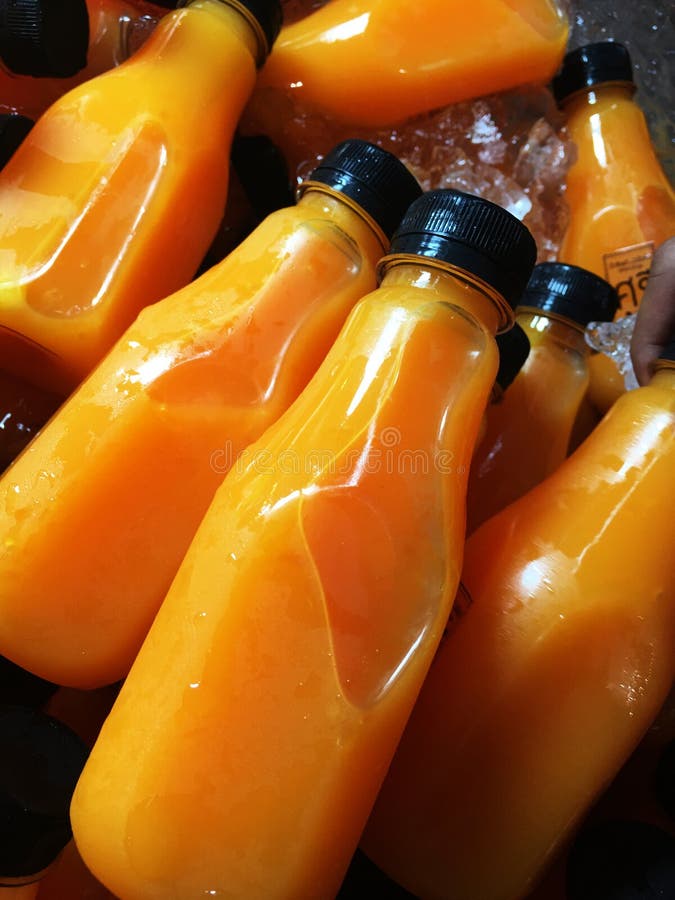 Orange Juice Bottles on the Ice Box Stock Image - Image of bottle ...