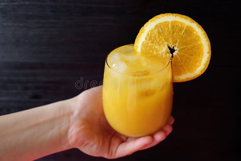 Orange Juice in Hand on Dark Background Stock Image - Image of juice ...