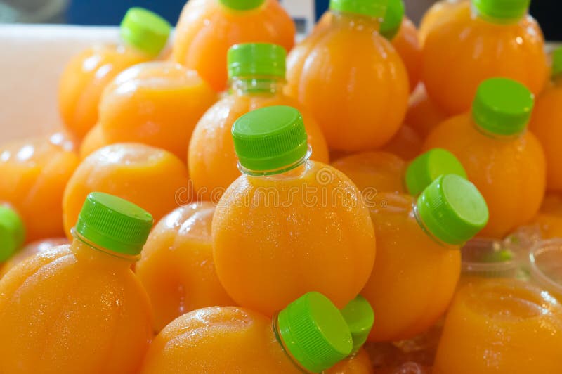 Orange Juice in Round Plastic Bottles on Sale Stock Image - Image of ... Orange Juice in Round Plastic Bottles on Sale Stock Image - Image of ...