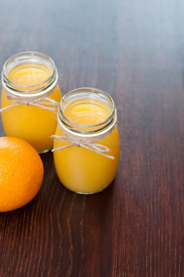 Orange Juice in Rustic Style Jars Side View, Copy Space Stock Image ...