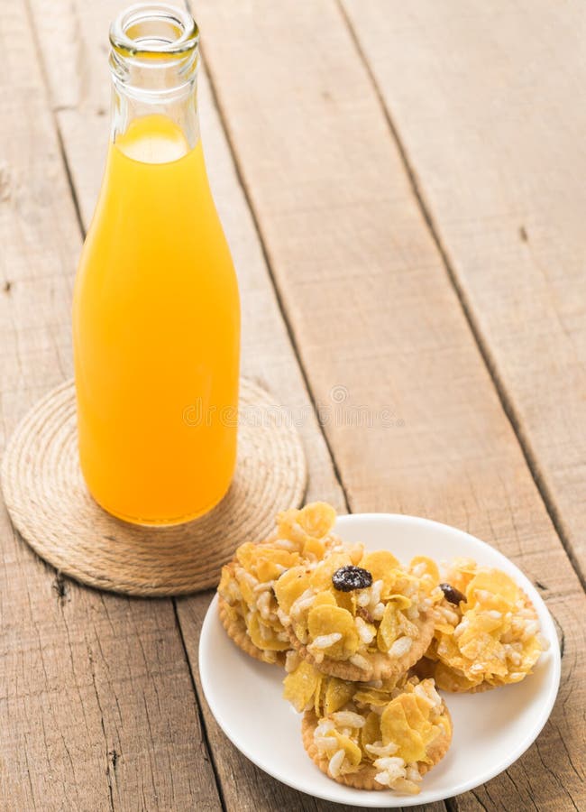 Orange Juice and Snack or Cracker in Close Up on Table Wood. Stock ...