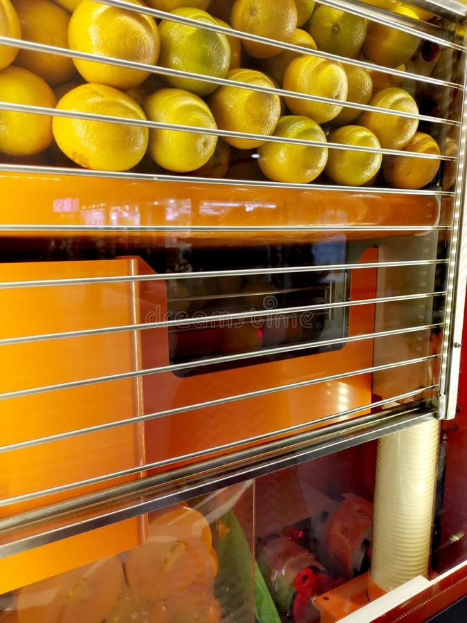 Orange Juice Vending Machine with Oranges Inside Stock Photo - Image of ...