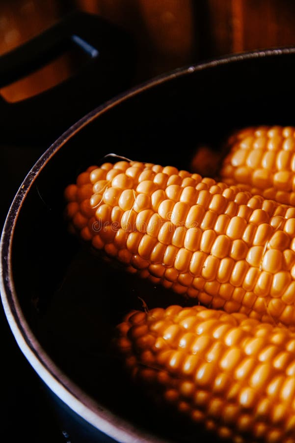 Orange Juicy Corn is Boiled in Water with Salt. Corn in Boiling Water ...