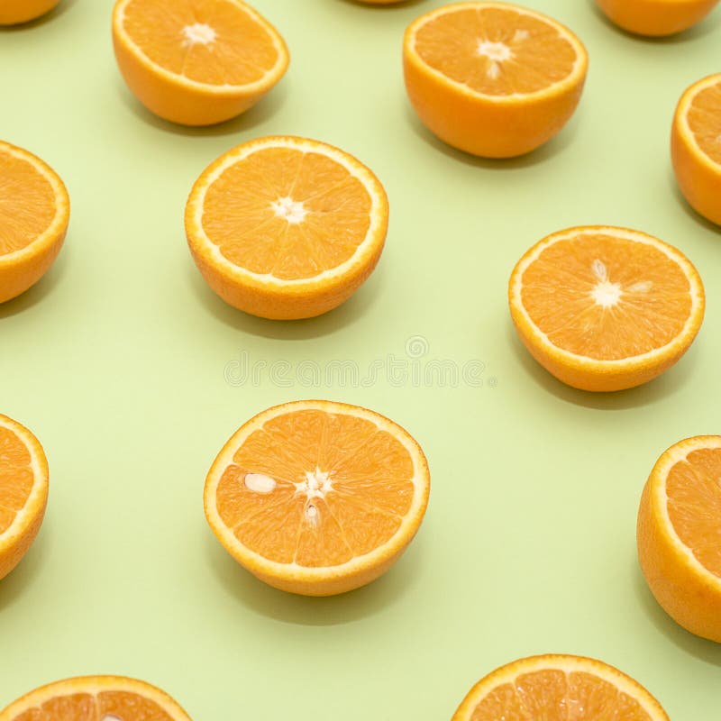 Orange Juicy Oranges Split In Half On Yellow Stock Photo - Image of ...