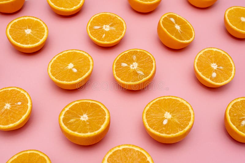 Orange Juicy Oranges Split in Half on Pink Stock Photo - Image of ...