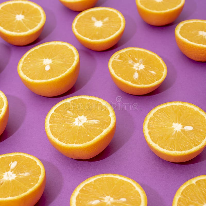Orange Juicy Oranges Split in Half on Purple Stock Image - Image of ...