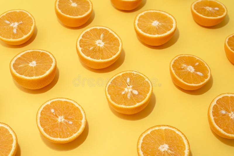 Orange Juicy Oranges Split in Half on Yellow Stock Image - Image of ...