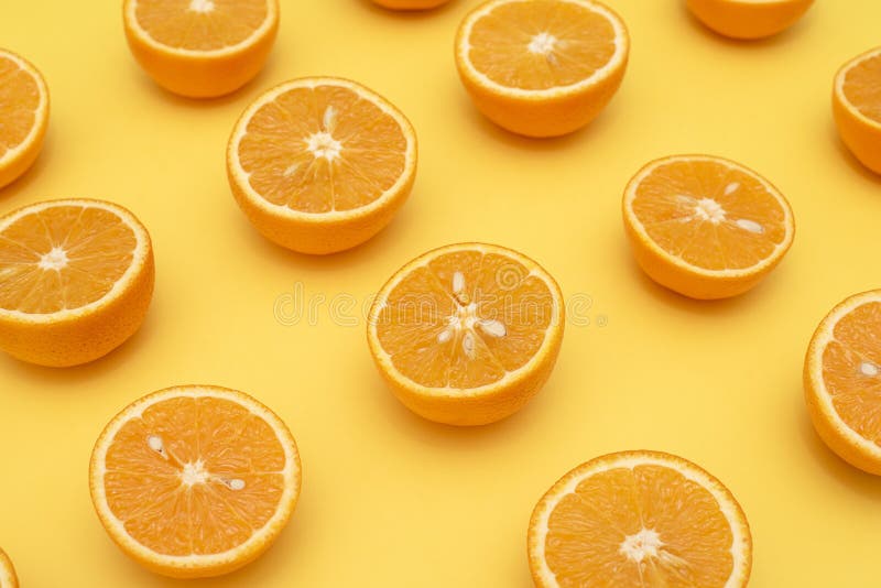 Orange Juicy Oranges Split in Half on Yellow Stock Photo - Image of ...