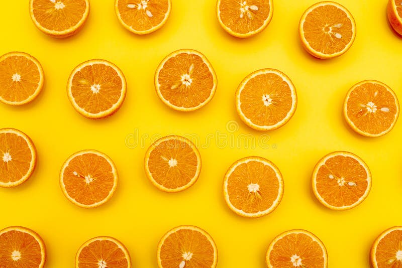 Orange Juicy Oranges Split In Half On Yellow Stock Photo - Image of ...