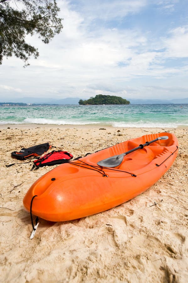 Orange Kayak on a Desert Island Beach. Stock Photo - Image of tree ...