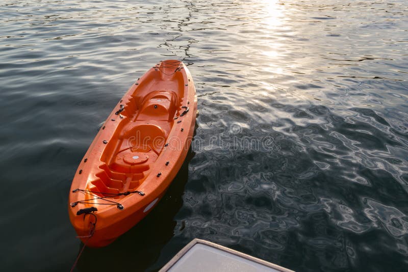 Orange kayak on the sea stock image. Image of couple - 185608117