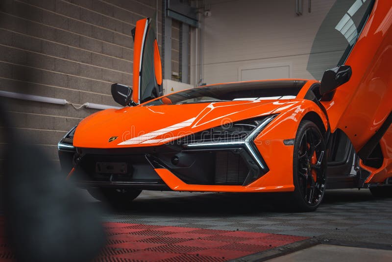 Orange Lamborghini Revuelto with Scissor Doors Open in Indoor Setting ...