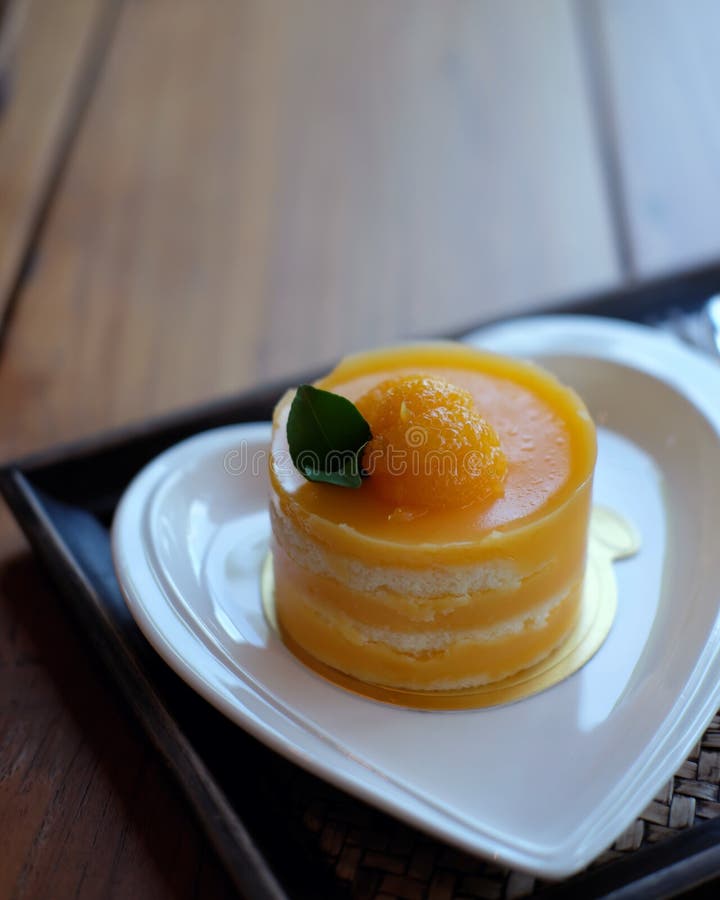 Orange Layer Cake in White Dish on the Table Stock Image - Image of ...