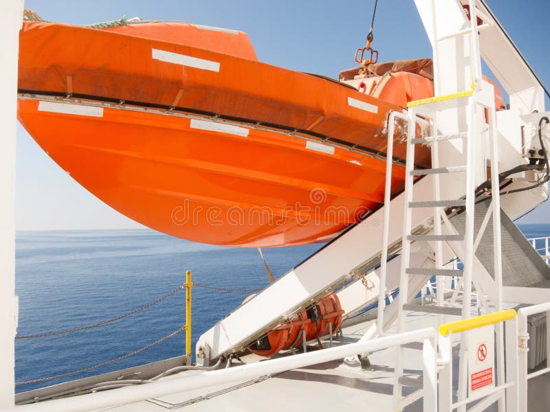 Orange Lifeboat on Deck of Cruise Ship Stock Photo - Image of hanging ...