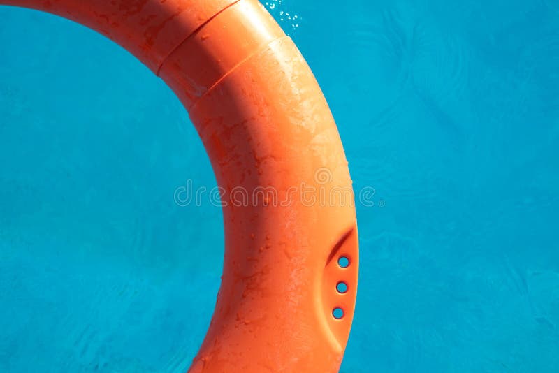 Orange Lifebuoy Floating on a Pool Stock Photo - Image of ring, outside ...