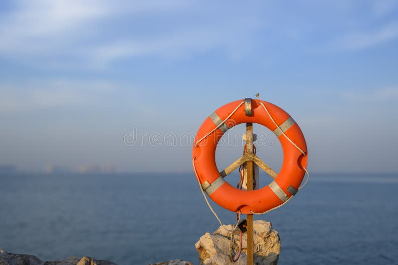 Orange Lifebuoy Placed at the Seaside To Prevent Drowning Stock Image ...