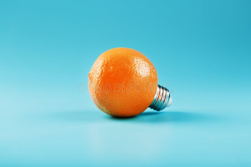 Orange Light Bulb on a Blue Background. the Concept of Fruit Ideas ...