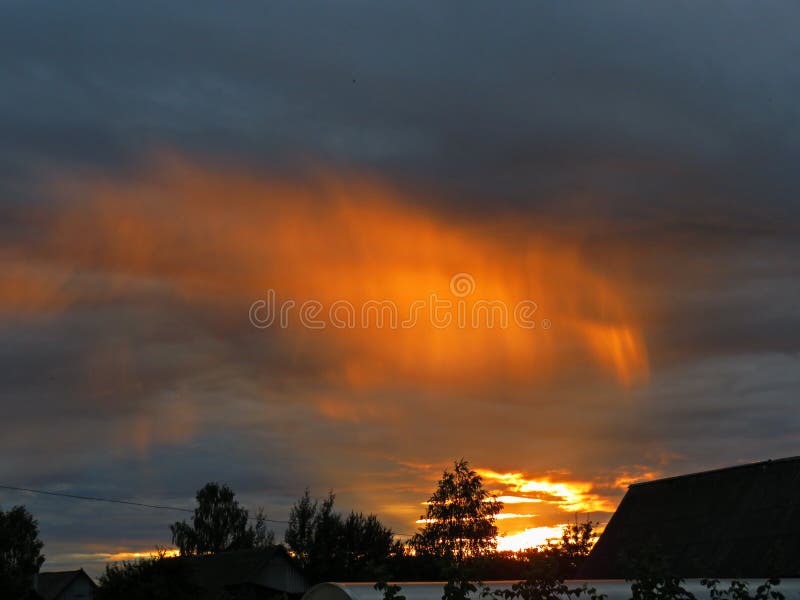 Unique Clouds, Illuminated by the Rays of the Setting Sun. Stock Photo ...