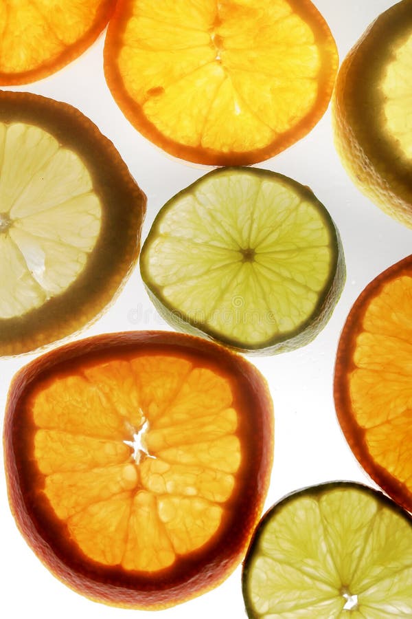 Orange, Lime and Lemon Slices Cut and Illuminated by the Light Stock ...