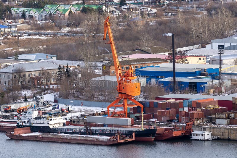 Orange Loading Crane on the River Pier. Stock Photo - Image of crane ...