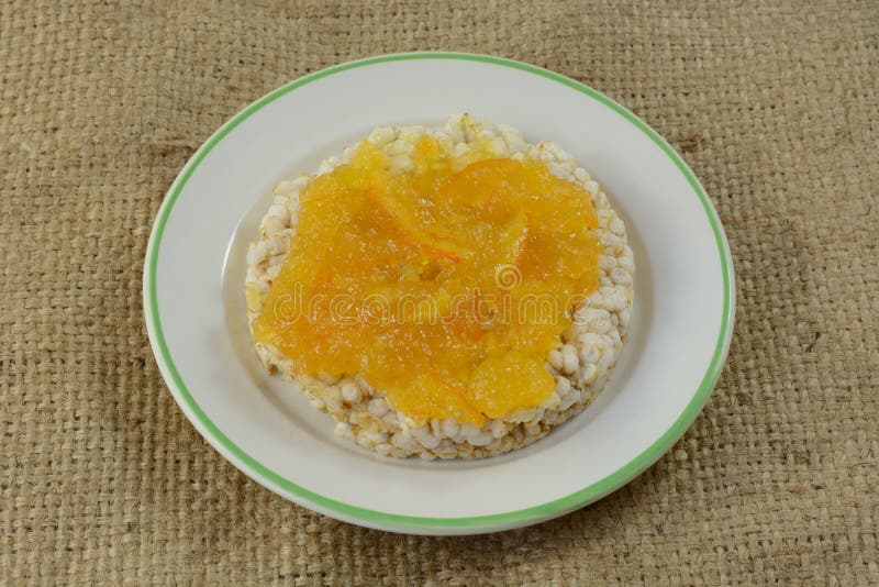 Orange Marmalade in Brown Rice Cake Stock Photo - Image of crunchy ...
