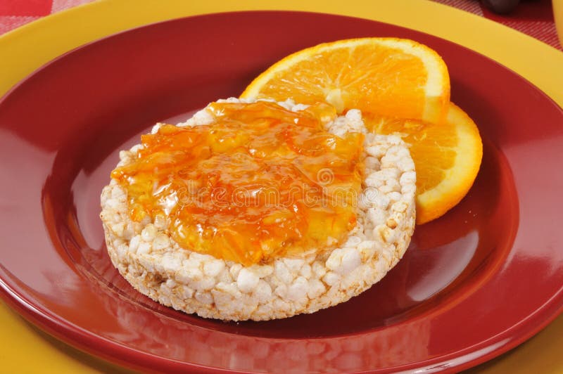 Orange Marmalade on a Rice Cake Stock Photo - Image of breakfast ...