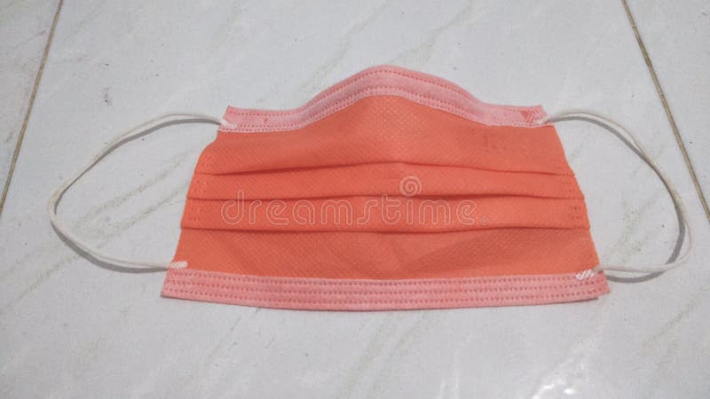 Orange Mask, during the Pandemic Now Masks are always Needed Stock ...
