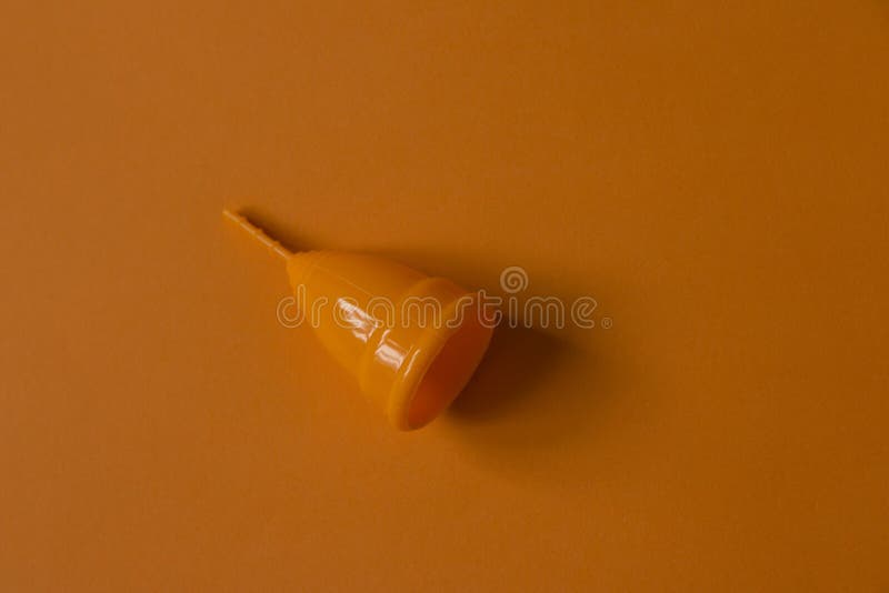 Orange Menstrual cup stock photo. Image of sanitary, soft - 95535564