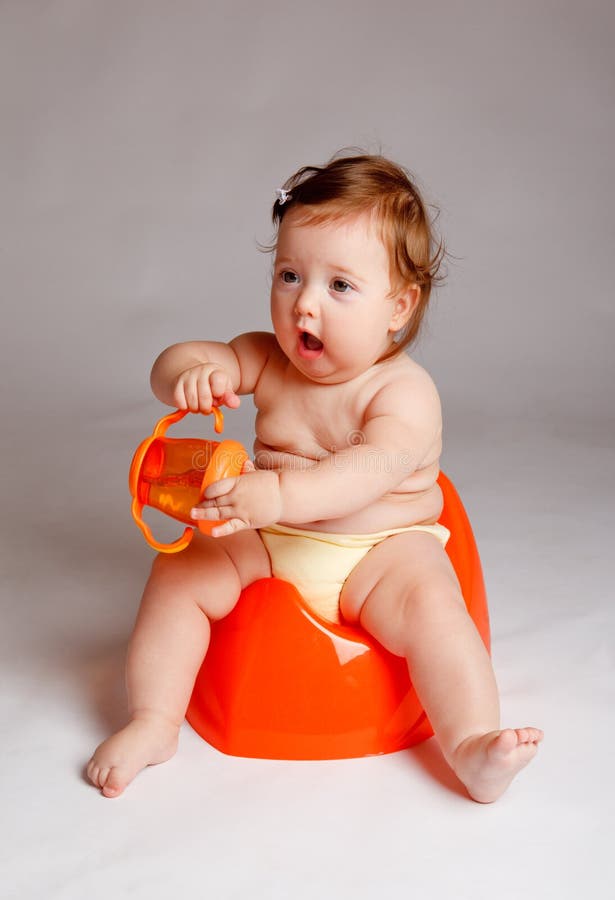 Surprised infant on potty. stock photo. Image of expression - 12028098