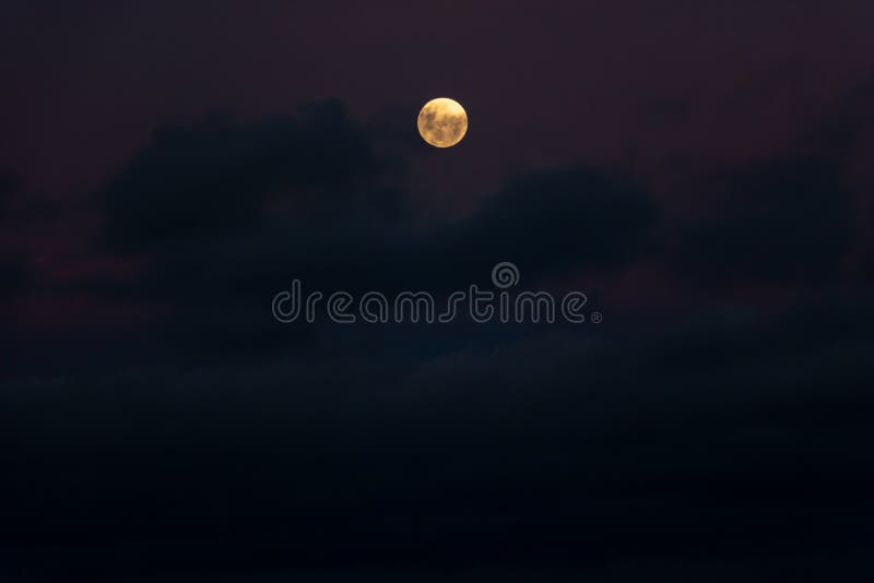Orange Moon with Purple Twilight Clouds Stock Image - Image of ...