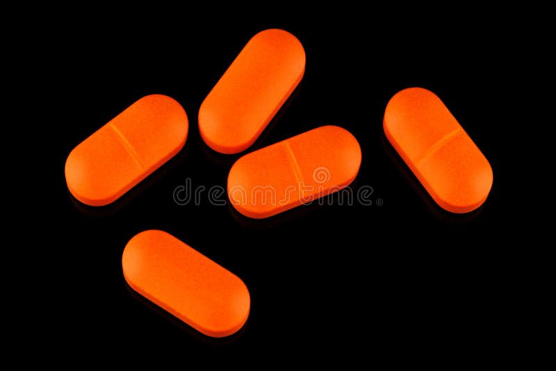 Orange Oblong Tablets Black Background Stock Photo - Image of ...