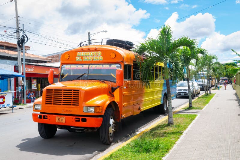 Orange Old School Bus Parked in the Street Editorial Image - Image of ...